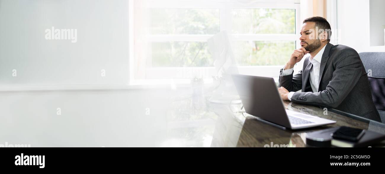 Contemplative Businessman Thinking And Pondering Near Office Computer ...
