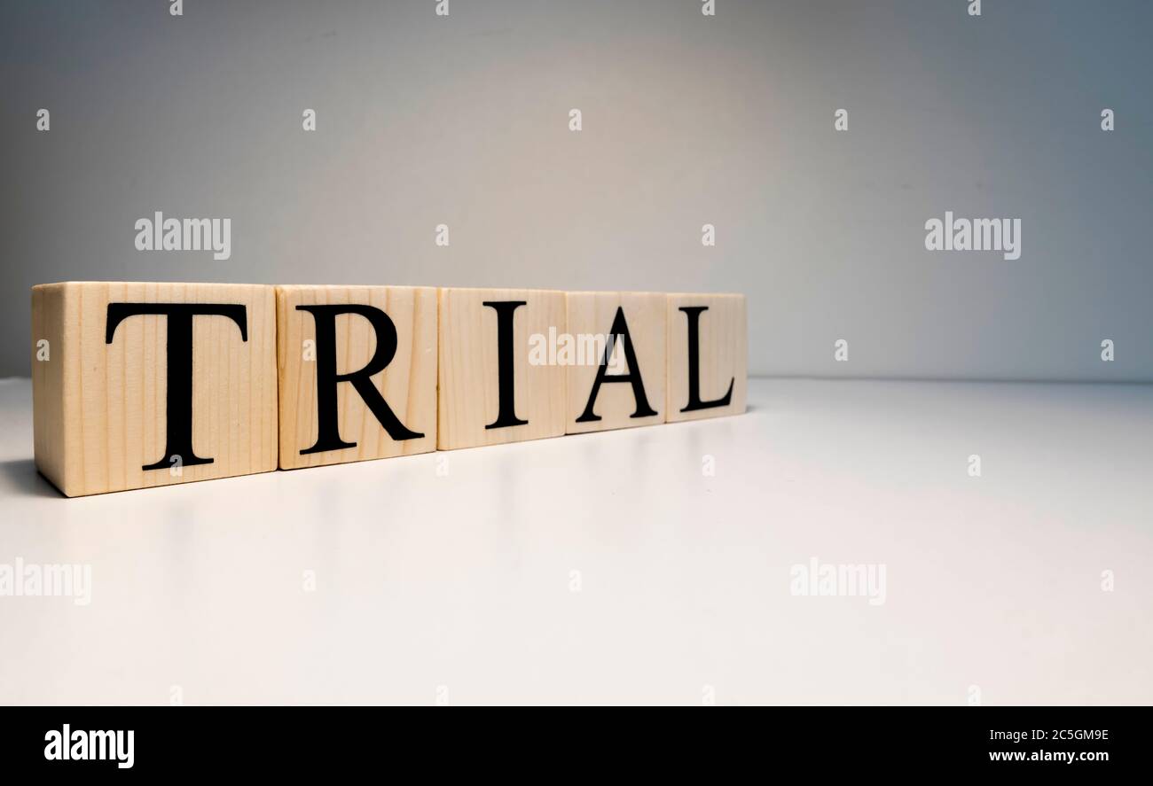 Trial word from wooden cubes. About law terms Stock Photo - Alamy