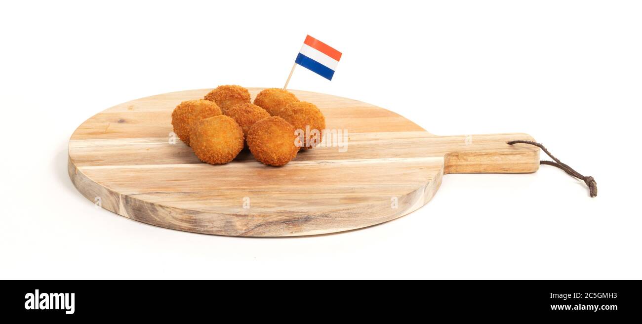 Dutch traditional snack bitterbal on a serving board, dutch flag ...