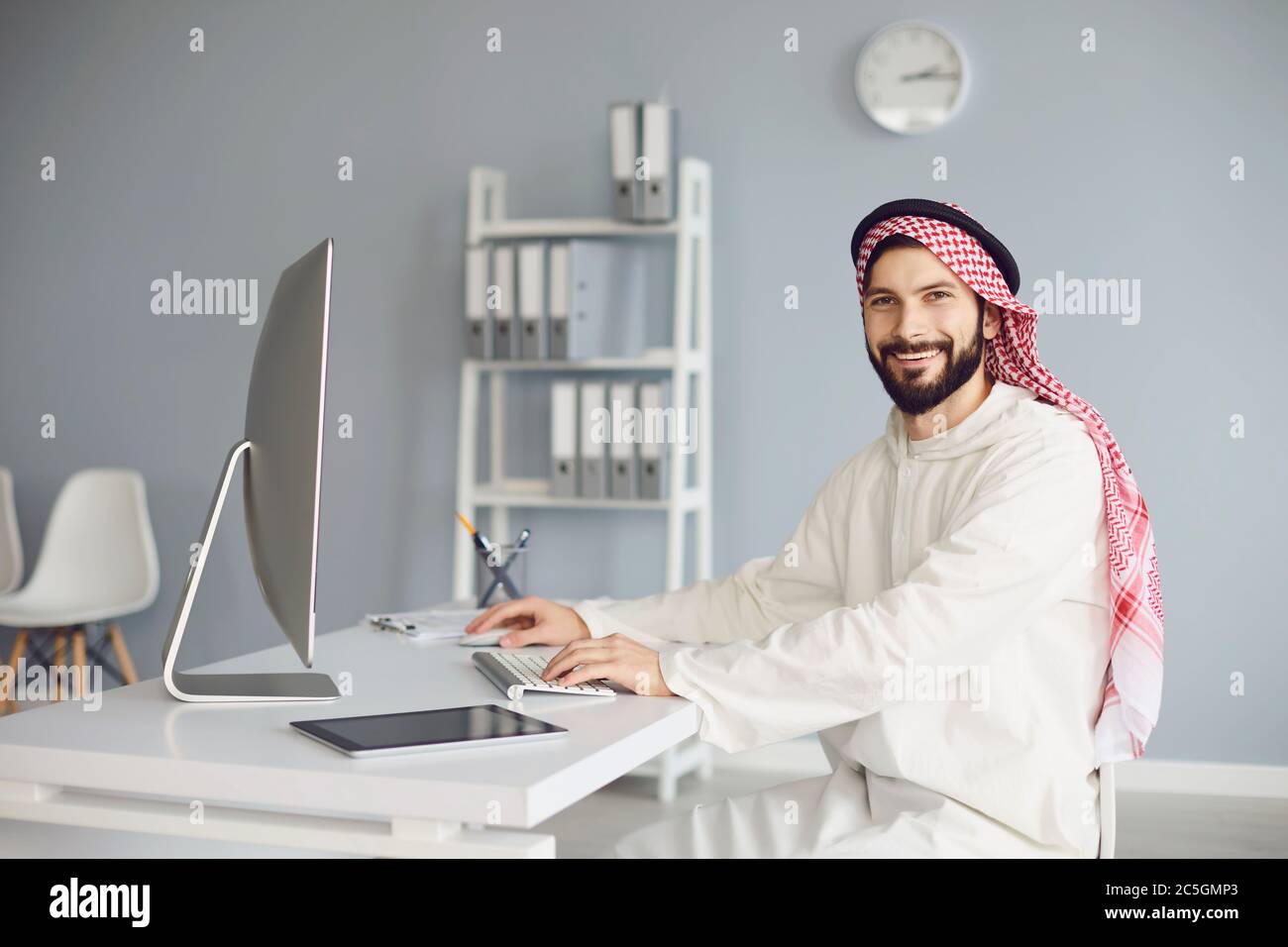 Arab businessman worker works in computer on the workplace in the ...