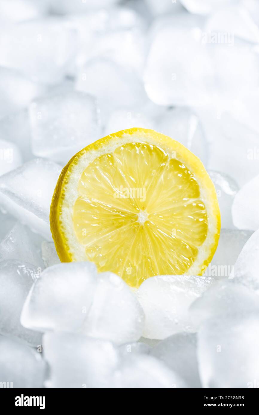 Slice of lemon on ice cubes Stock Photo - Alamy