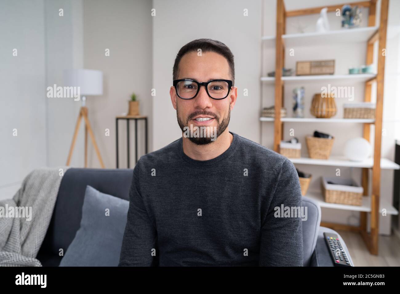 Man on couch wearing hi-res stock photography and images - Alamy