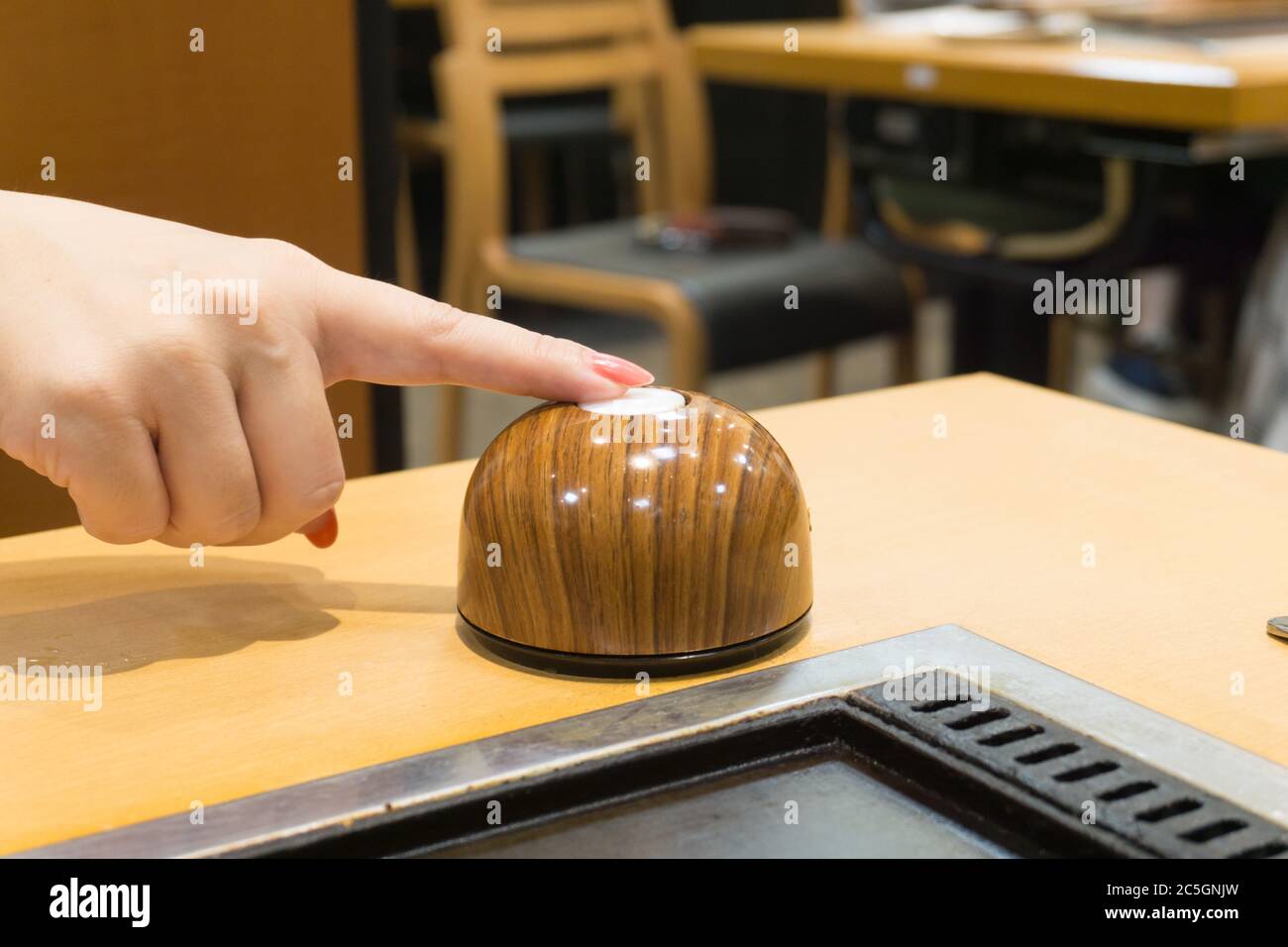 Hand and ring bell service Stock Photo - Alamy