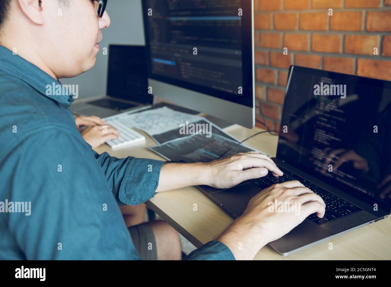 Two Partnerships Developing Programming And Coding Technologies Working On Laptop And Analyzing