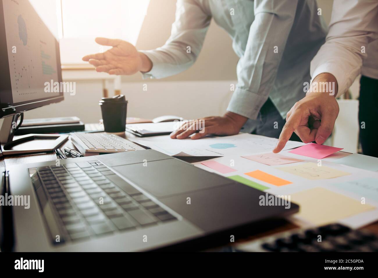 Businessman point to the graph of the company financial statements in ...