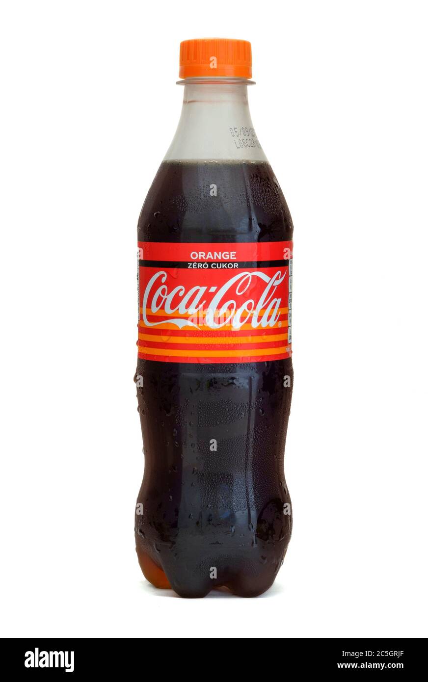 bottle of orange flavoured coca cola cut out against white background ...
