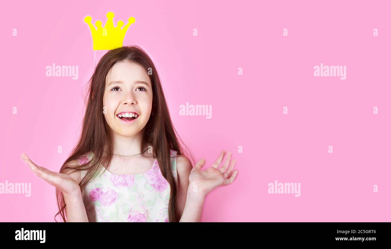 Little girl princess, crown, isolated on pink background. Kid wear ...