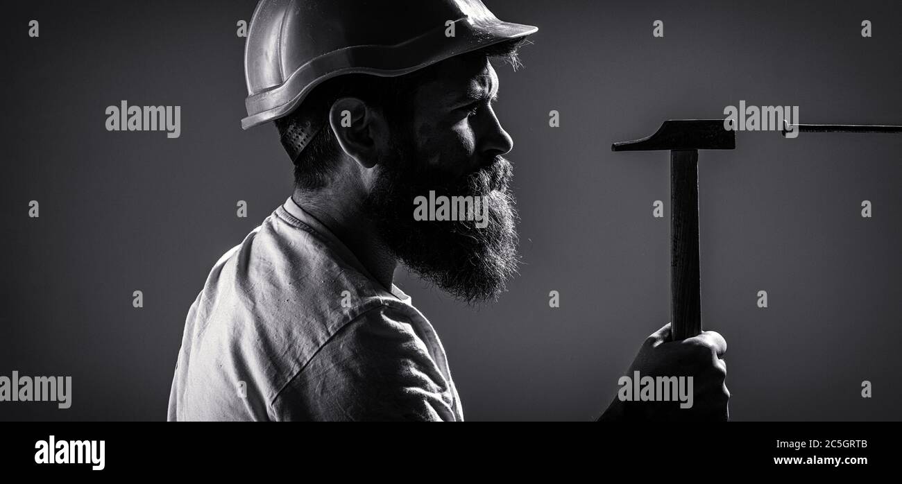 Builders in hard hat, helmet. Handyman, hammer, man builder, industry ...