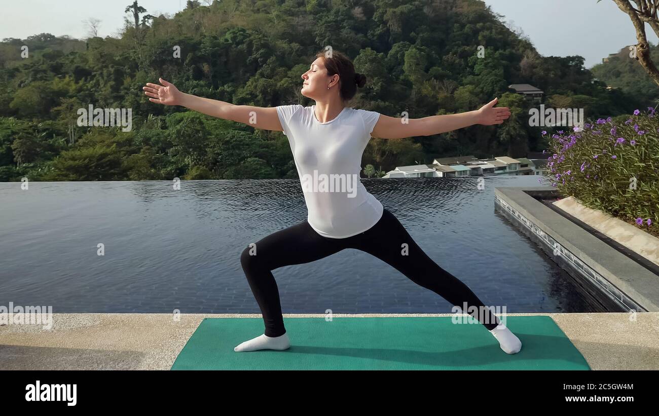Morning exercises. Woman performs yoga asanas in the fresh air Stock ...