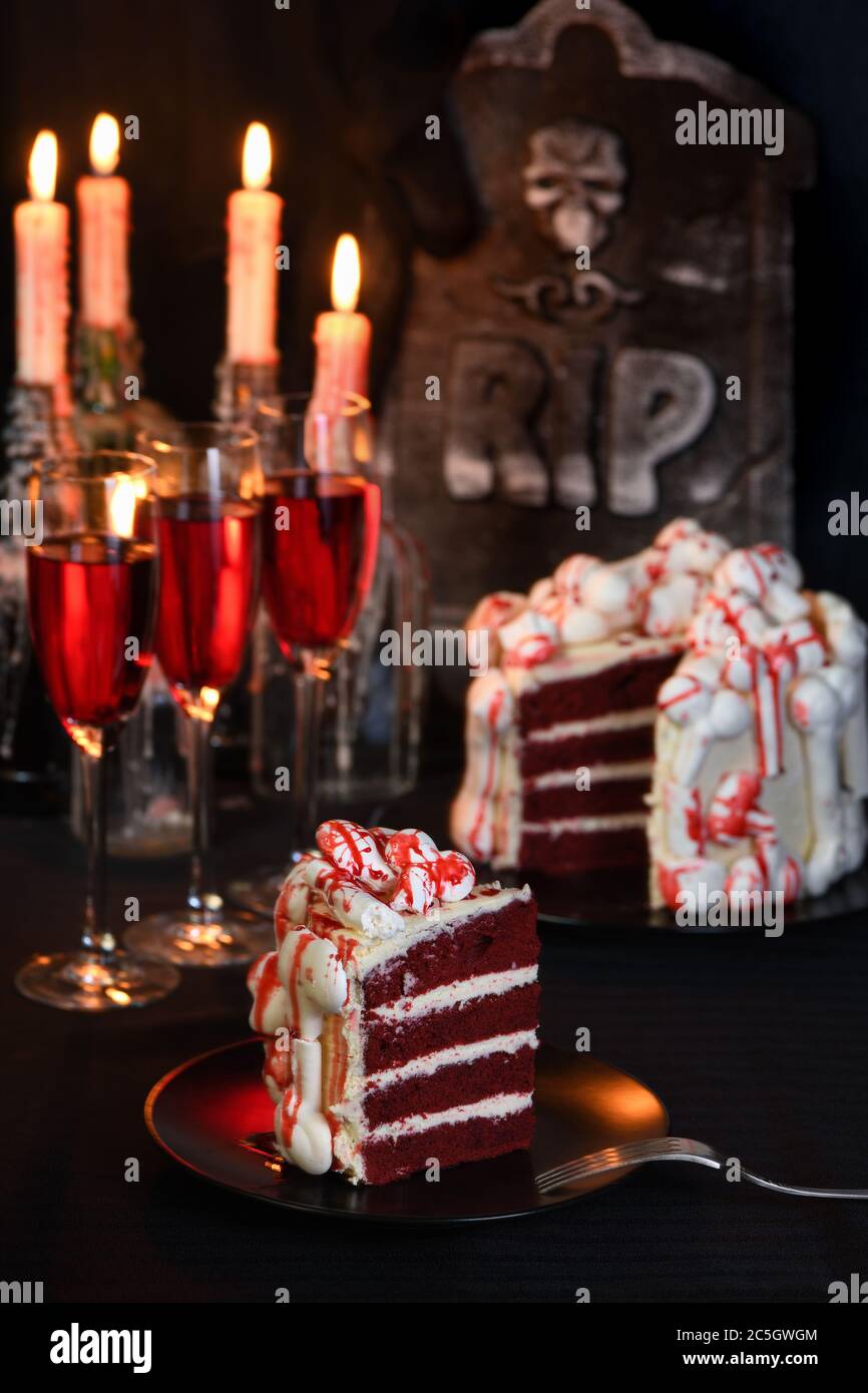 A piece of creepy cake (red velvet), decorated with meringue bones and ...