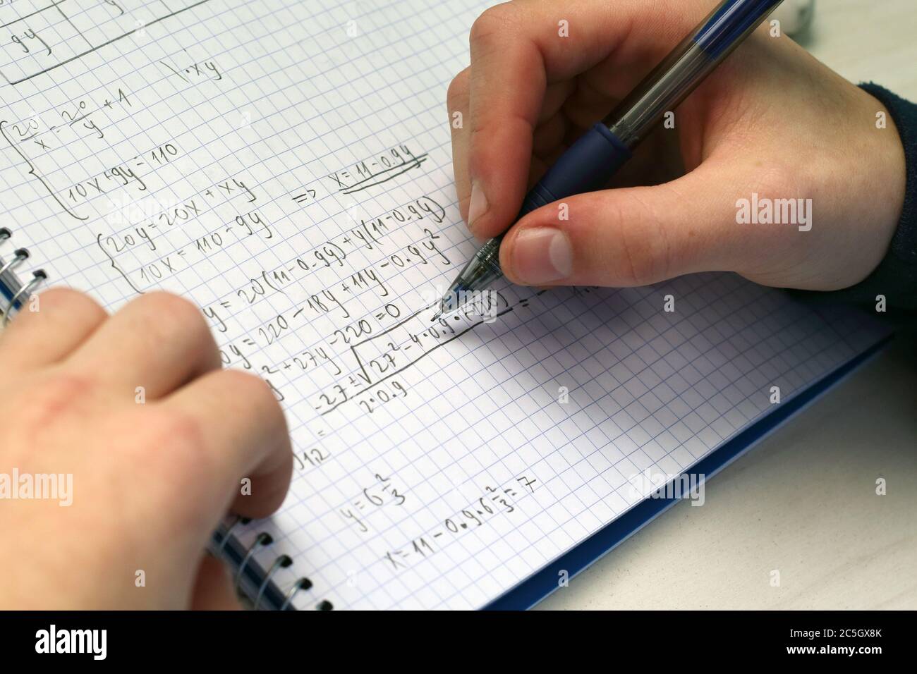 Child solving equation notebook hi-res stock photography and images - Alamy