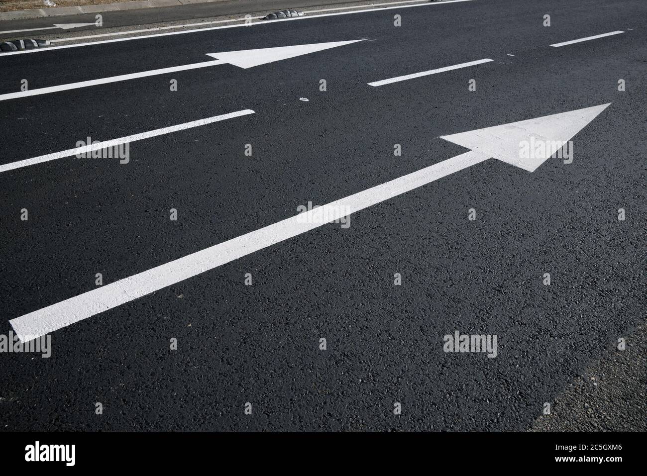 Two arrow directional signals on the floor Stock Photo - Alamy