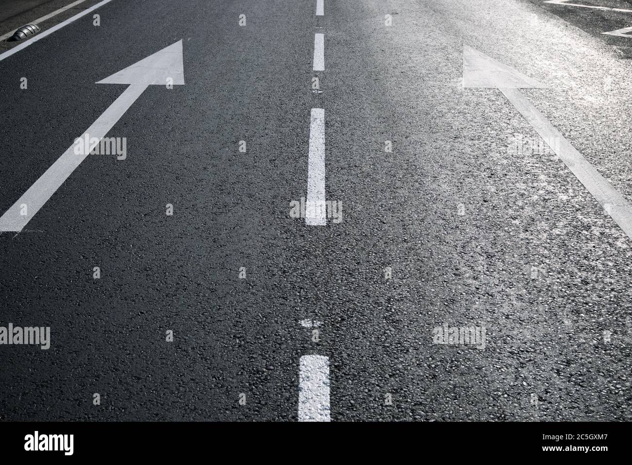 Two arrow directional signals on the floor Stock Photo - Alamy