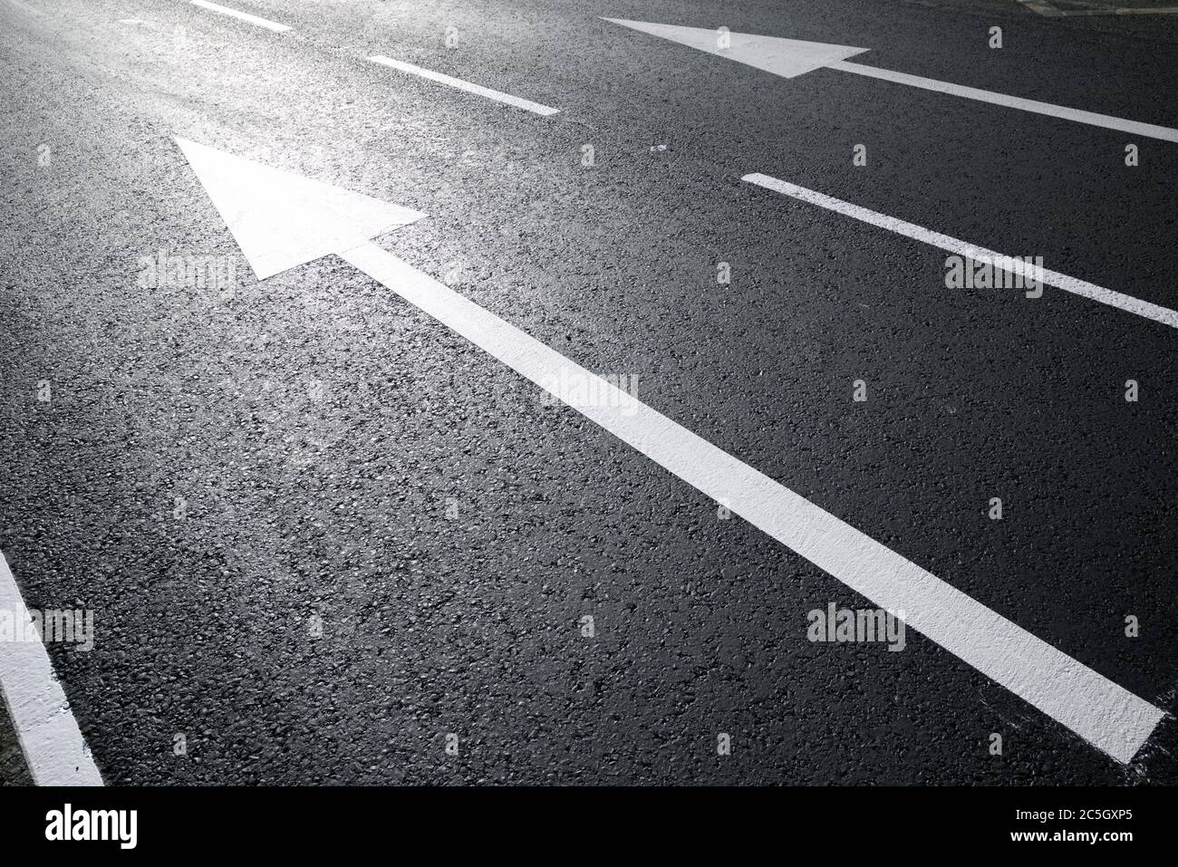 Two arrow directional signals on the floor Stock Photo - Alamy