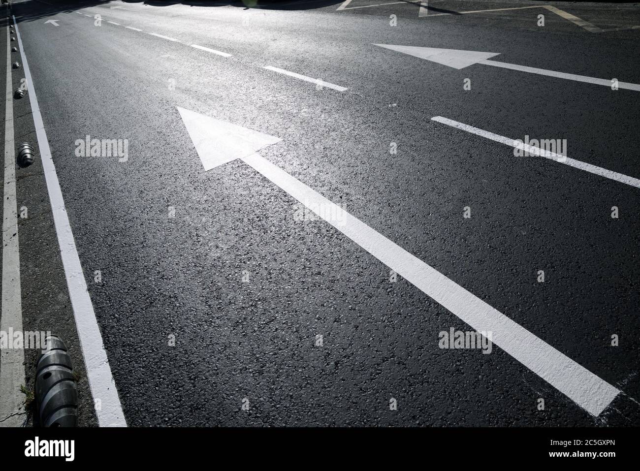 Two arrow directional signals on the floor Stock Photo - Alamy