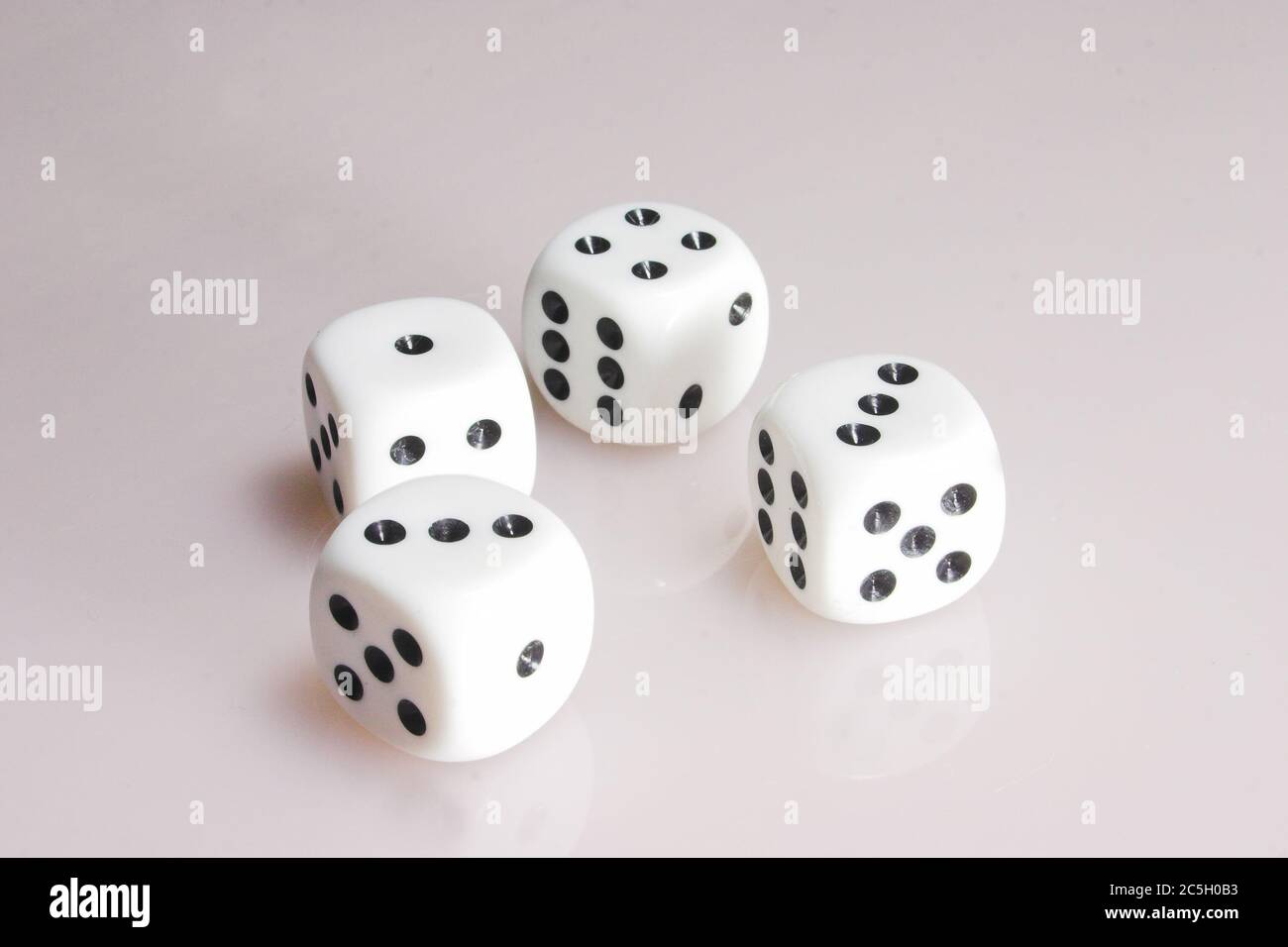 four cubes against a light background Stock Photo - Alamy
