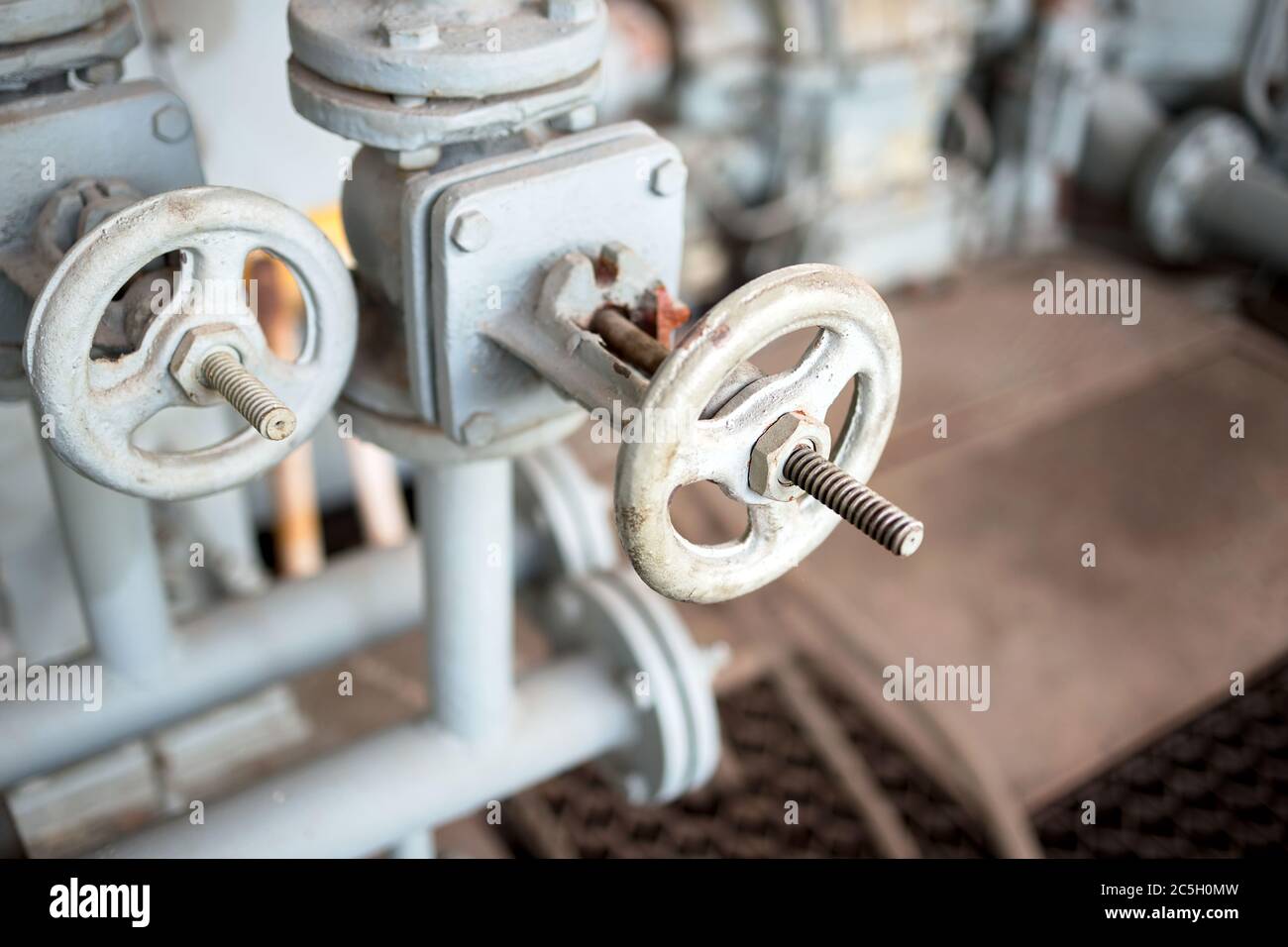 Industrial blue painted pipeline flanges, hand wheel and two valves ...