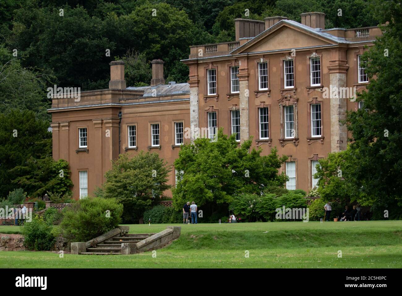 Himley Hall with croquet players on lawn. Summer. July 2020. British ...