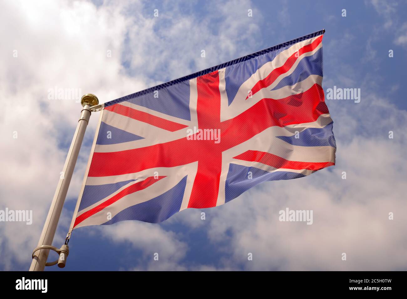 union jack flag on blue sky Stock Photo - Alamy