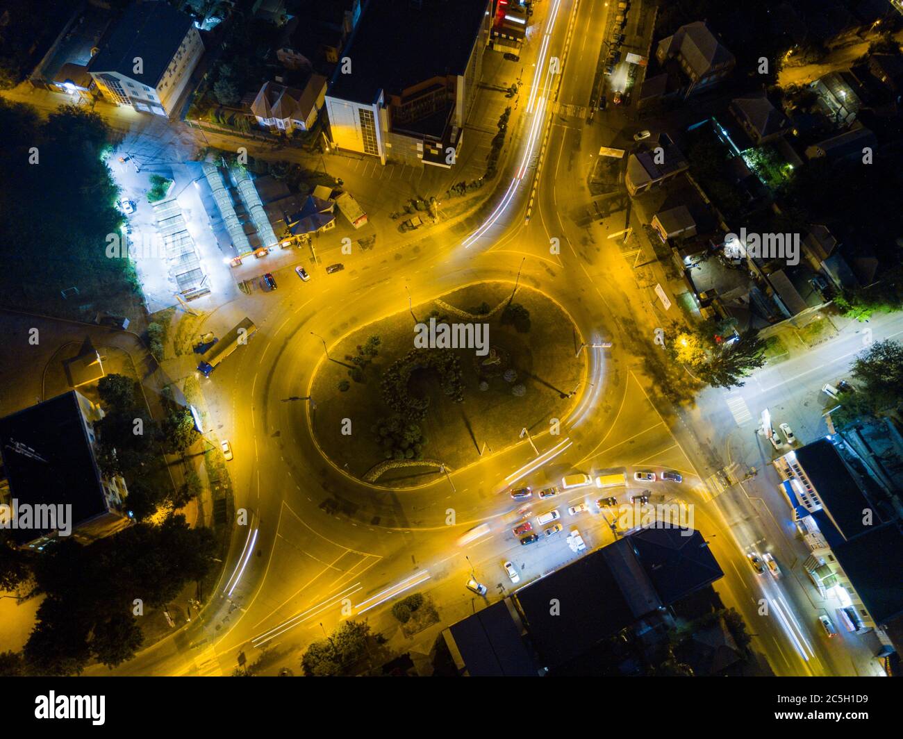 The light on the road roundabout at night and the city. Aerial view ...