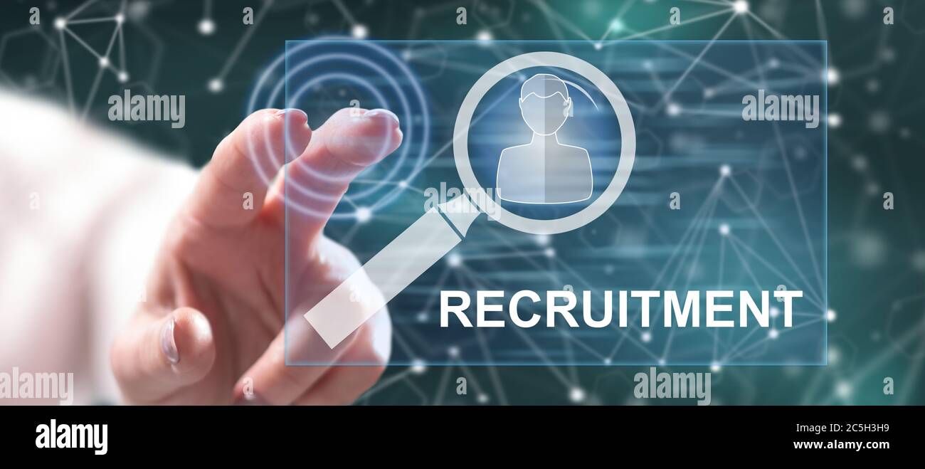 Woman touching a recruitment concept on a touch screen with her finger ...