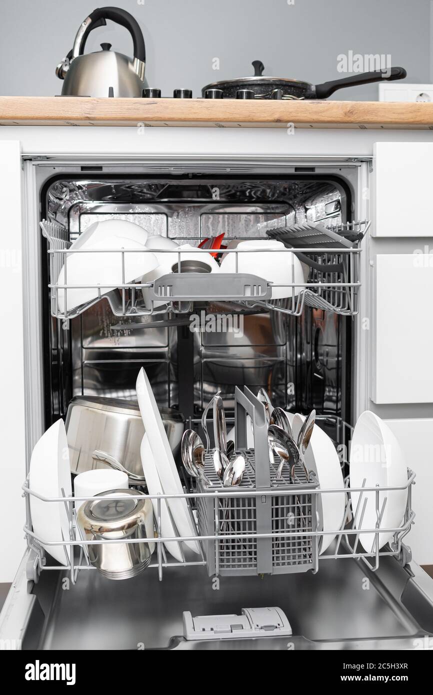 Loading a dishwasher hi-res stock photography and images - Alamy