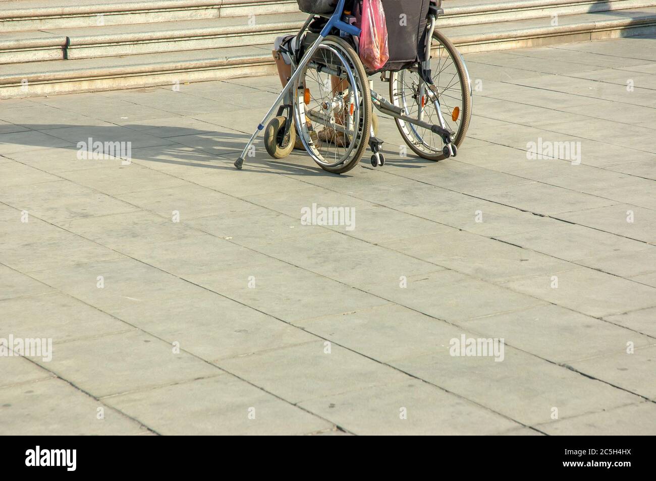 Back view of disabled man in wheelchair Stock Photo - Alamy