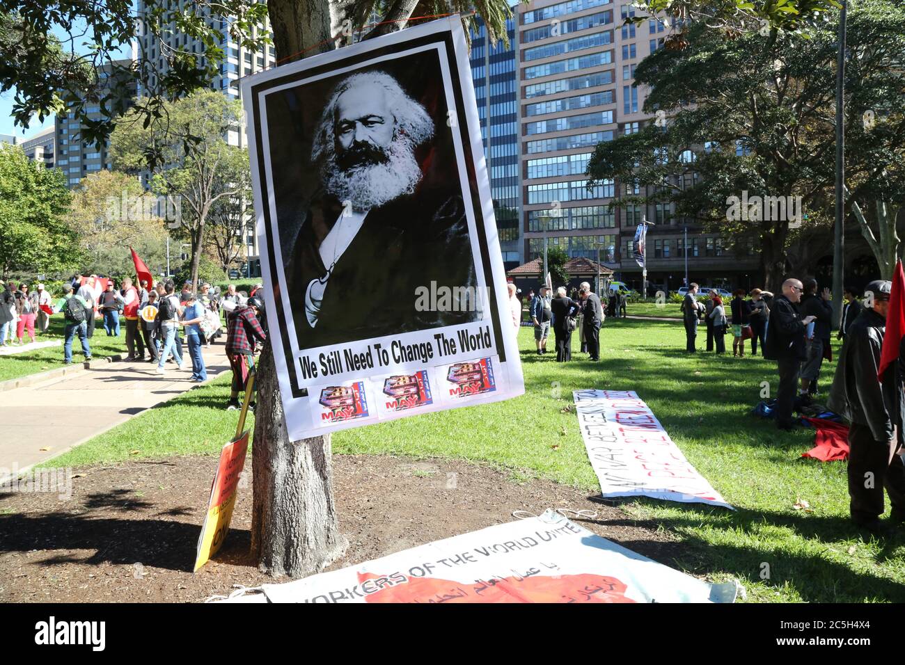 A picture of Karl Marx was attached to a tree at the May Day rally in ...