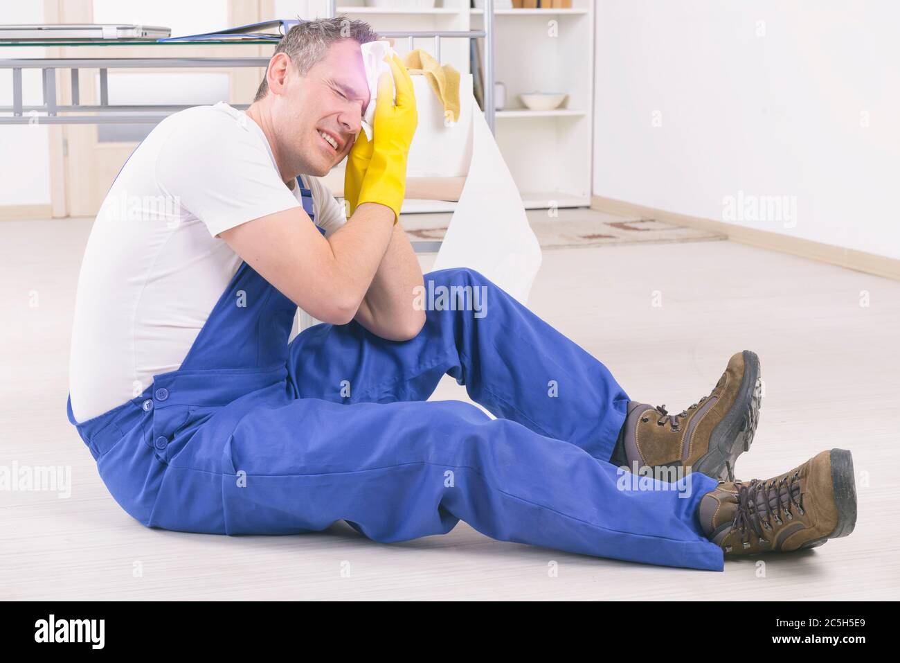 Man worker with head injury, concept of accident at work Stock Photo ...