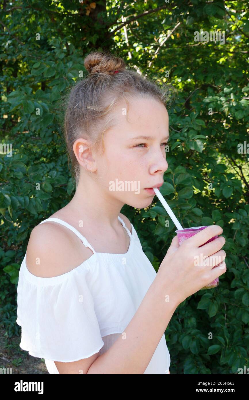 Woman drink juice through straw hi-res stock photography and images - Alamy