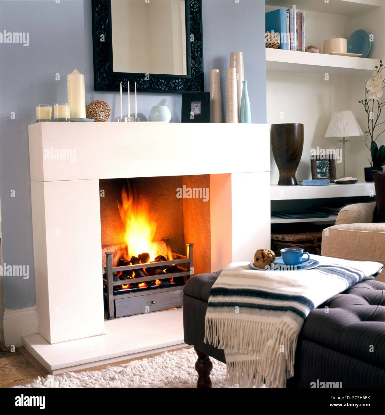 Modern fireplace withopen fire Stock Photo - Alamy