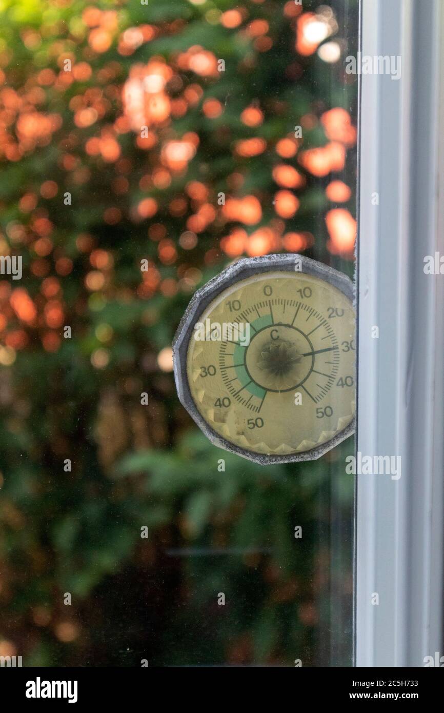round thermometer on the window outdoors Stock Photo - Alamy