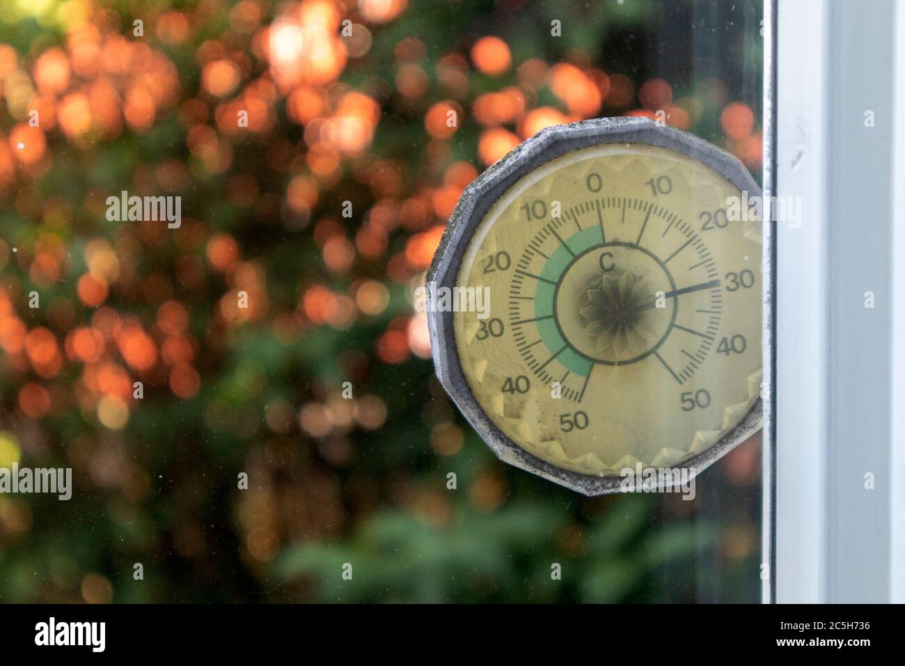 round thermometer on the window outdoors Stock Photo - Alamy