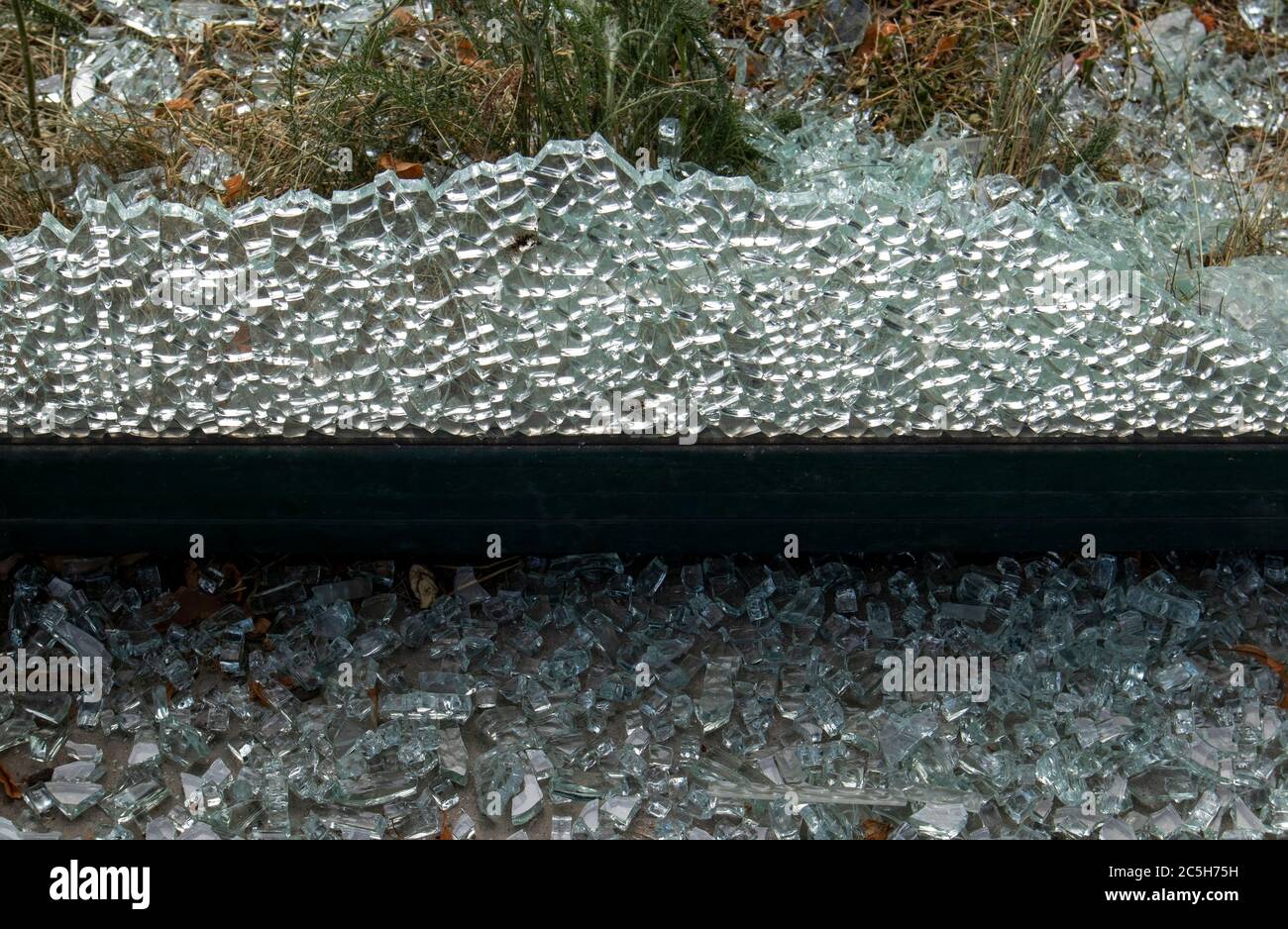 broken glass at a train station platform shelter Stock Photo - Alamy
