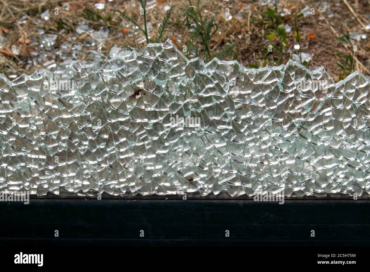 broken glass at a train station platform shelter Stock Photo - Alamy