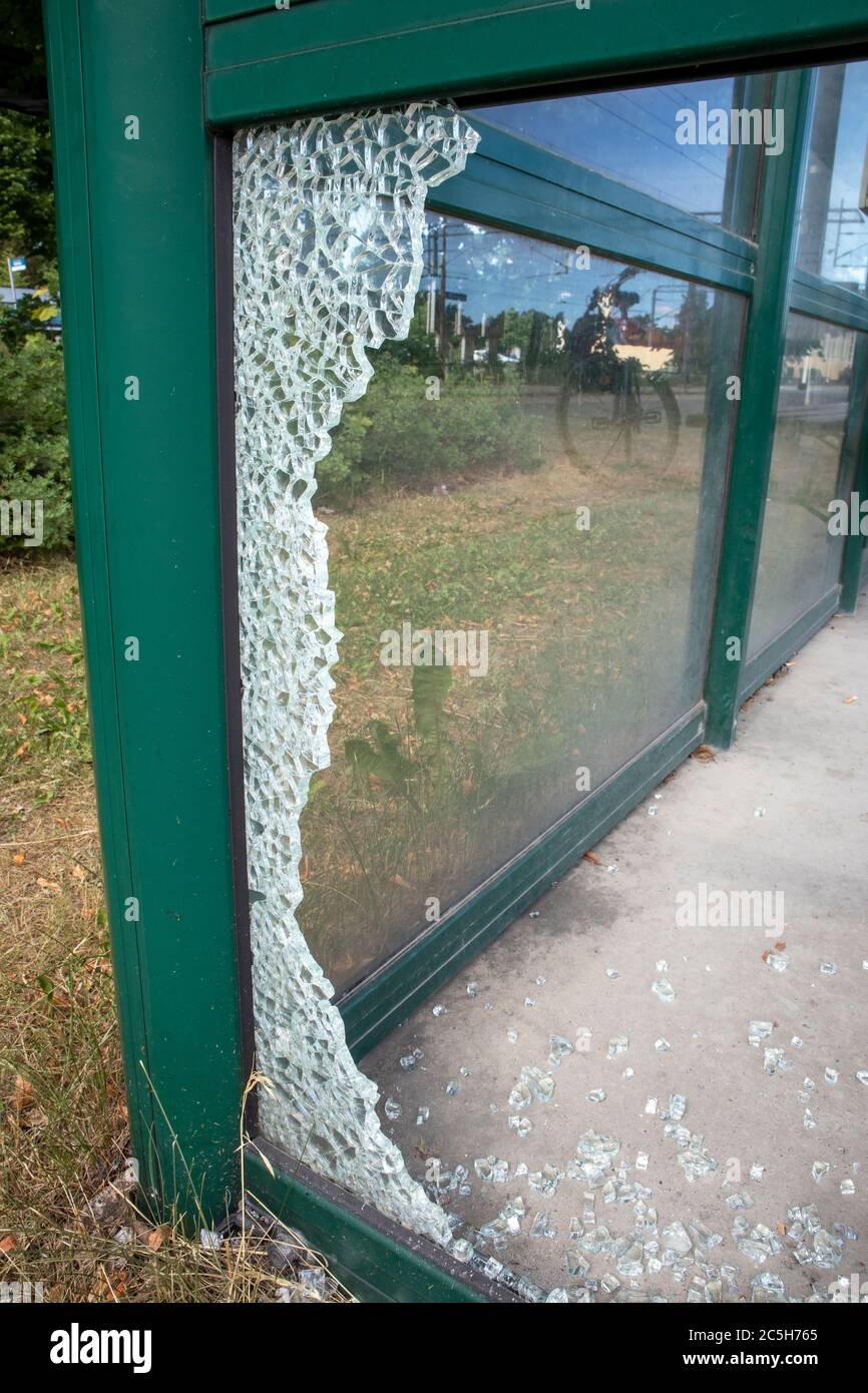 broken glass at a train station platform shelter Stock Photo - Alamy