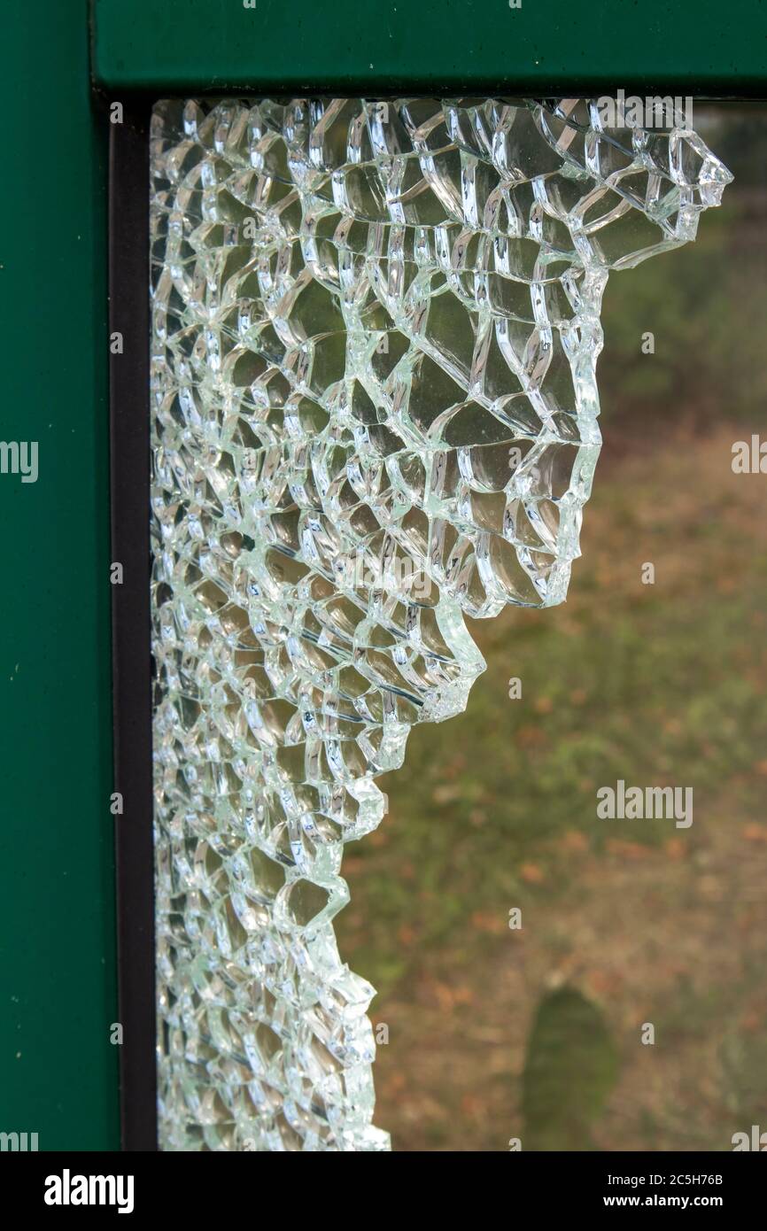 broken glass at a train station platform shelter Stock Photo - Alamy