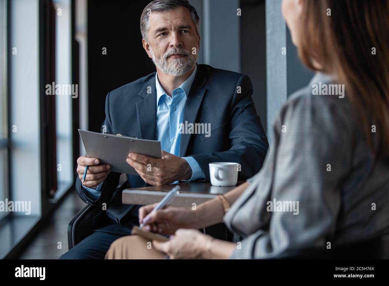 Mature female boss in eyeglasses hi-res stock photography and images ...
