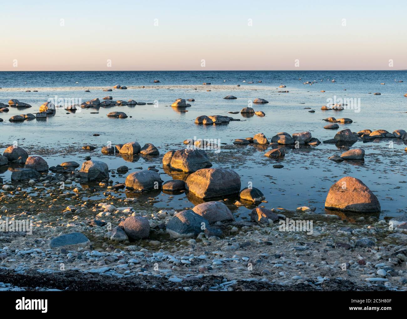 beautiful sunset landscape from a traditional rocky beach on the island ...