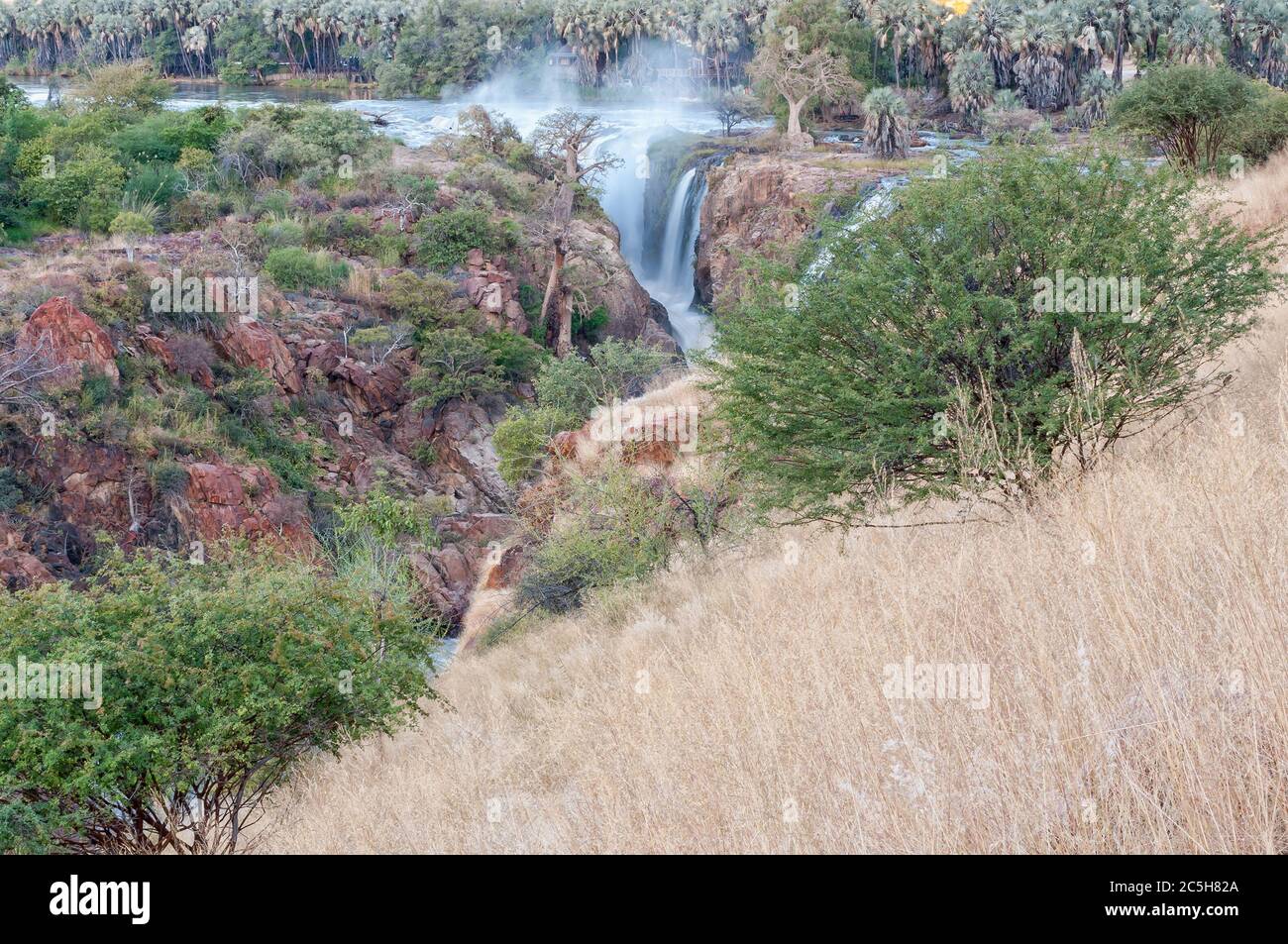 Part of the Epupa waterfalls in the Kunene River after sunset. Baobab ...