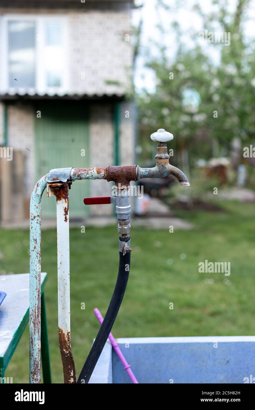 Old, rusty water tap in the country Stock Photo - Alamy