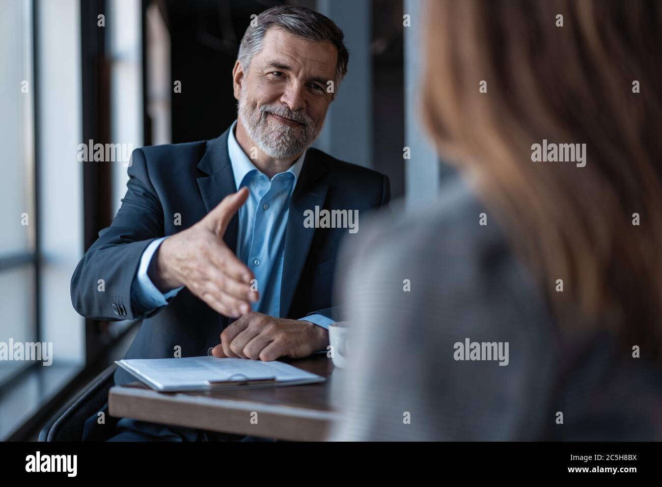Happy recruiting manager congratulating female vacancy candidate ...