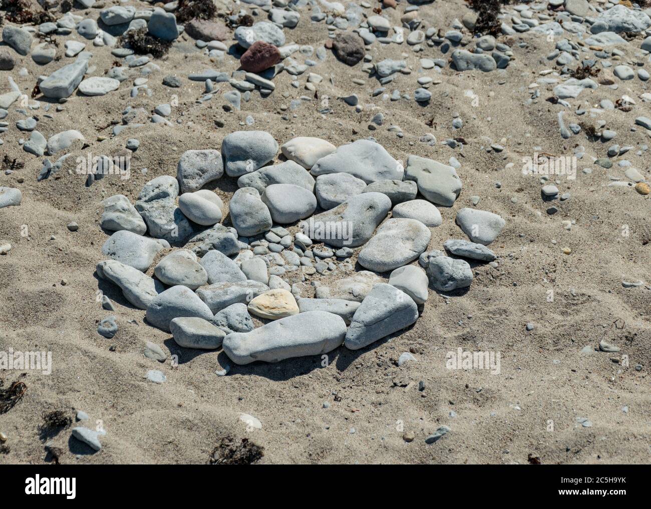 picture with beautiful white stone piles by the sea, these objects were ...