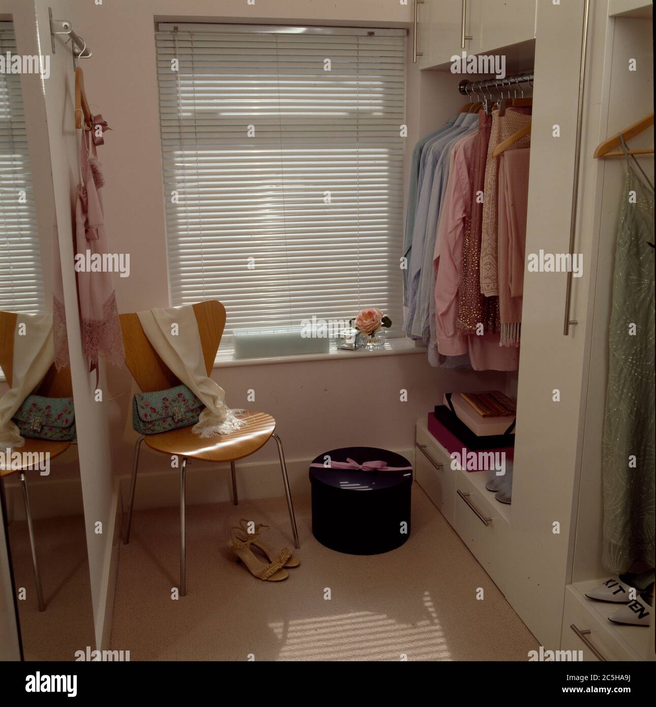 Dressing room with venetian blind covered window Stock Photo - Alamy