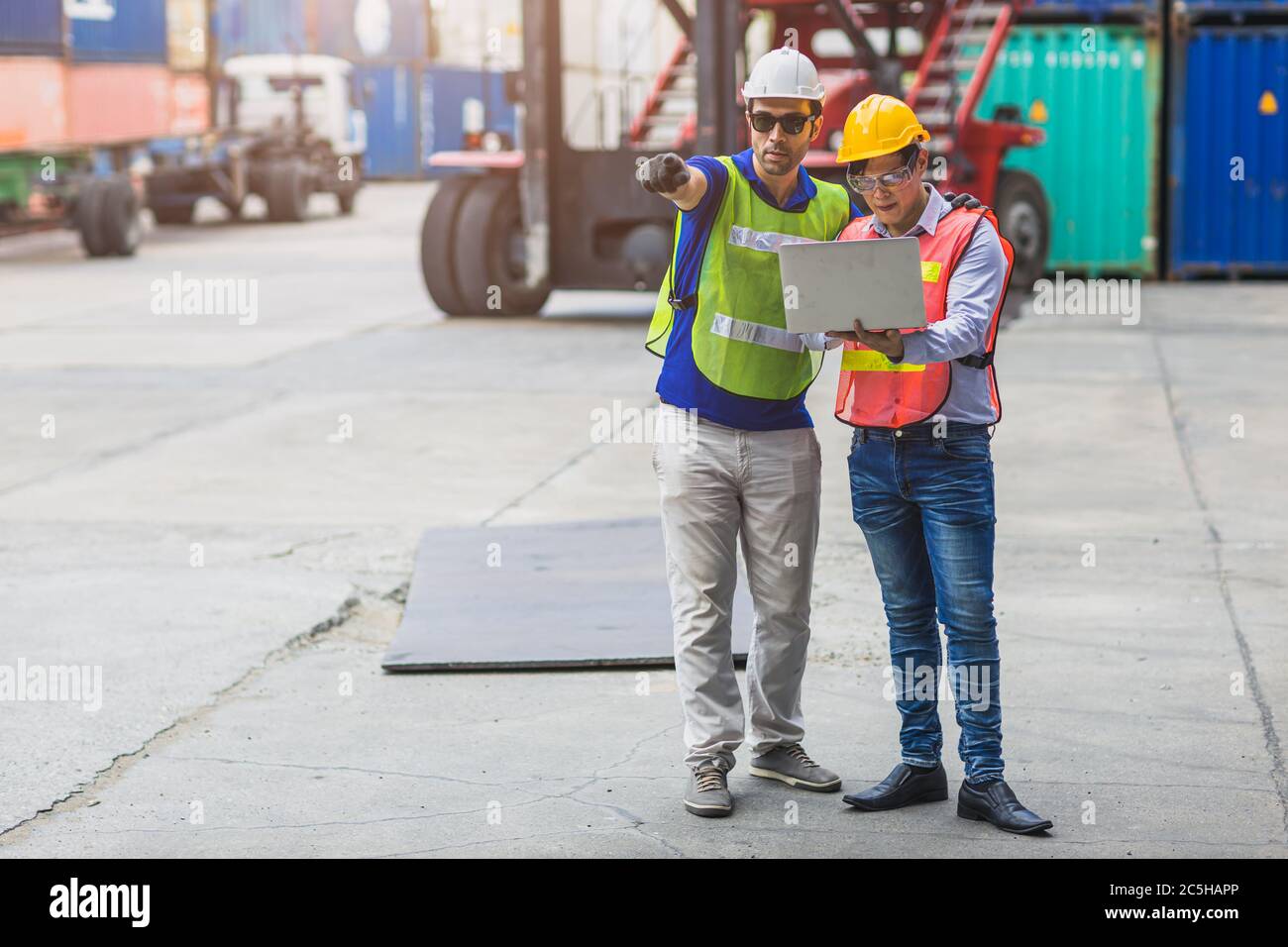 Logistic worker mix race working team together with online wireless ...