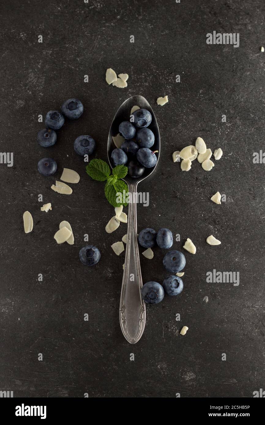 mystic light blueberries on dark background Stock Photo - Alamy