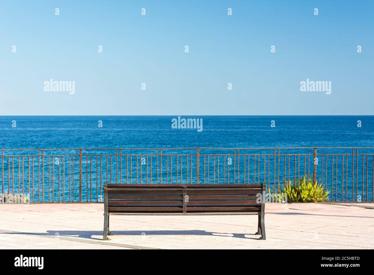 Lonely bench facing beautiful ocean panorama on Sicily, Italy Stock ...