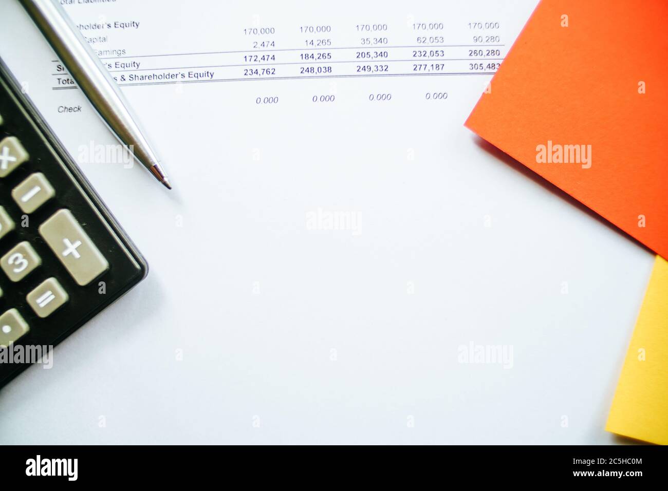Financial calculation numbers chart with pen, calculator and post it ...
