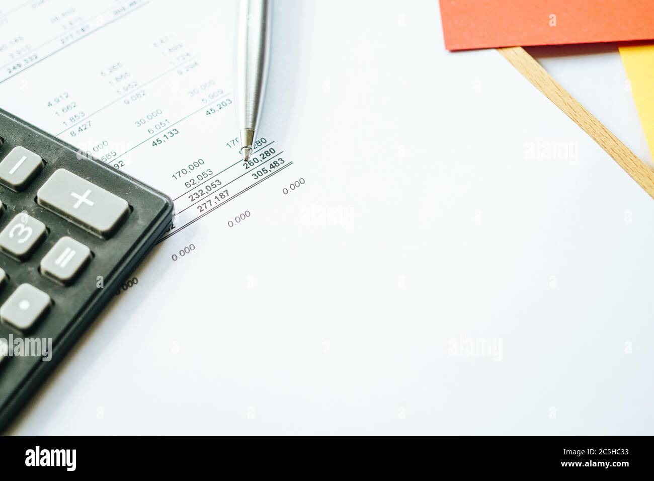 Financial calculation numbers chart with pen, calculator and post it ...