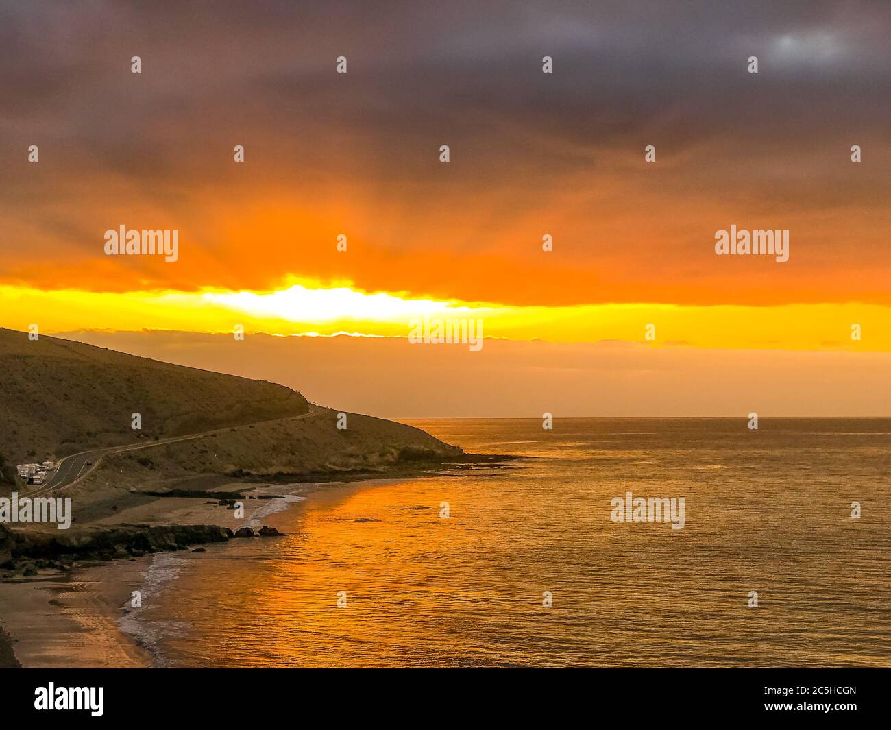 Sunrise from a cliff with moving clouds in a different direction ...